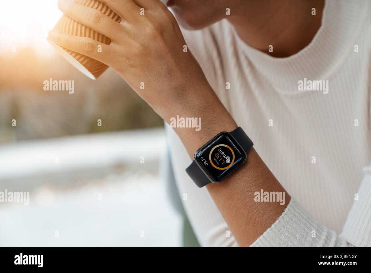 smartwatch showing calorie alert app on woman hand Stock Photo - Alamy