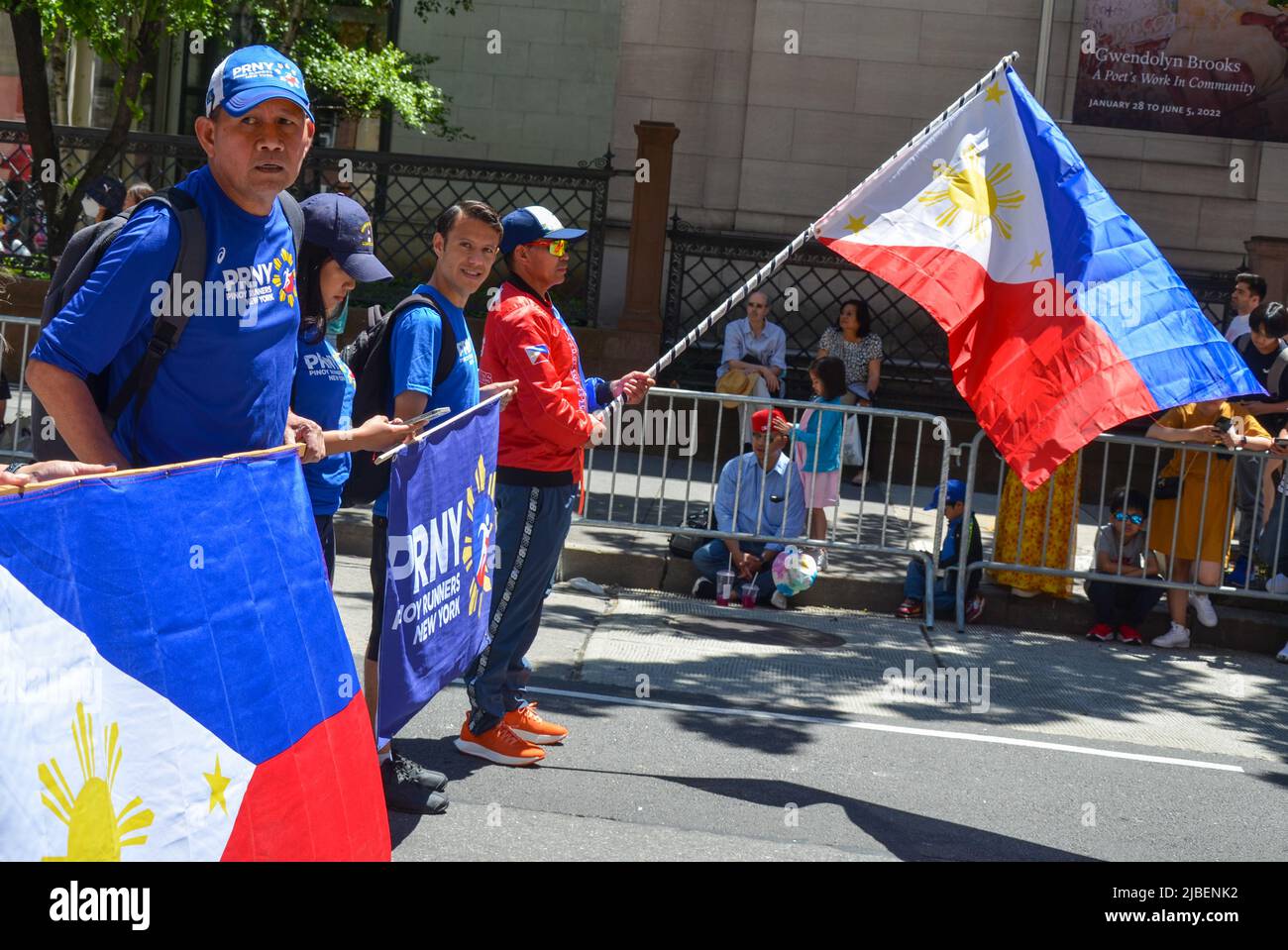 Marchers are seen holding Filipino flags during the annual Philippine ...