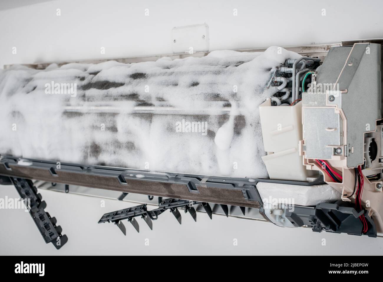 Cleaning air conditioner indoor unit. Maintaining the air conditioner ...