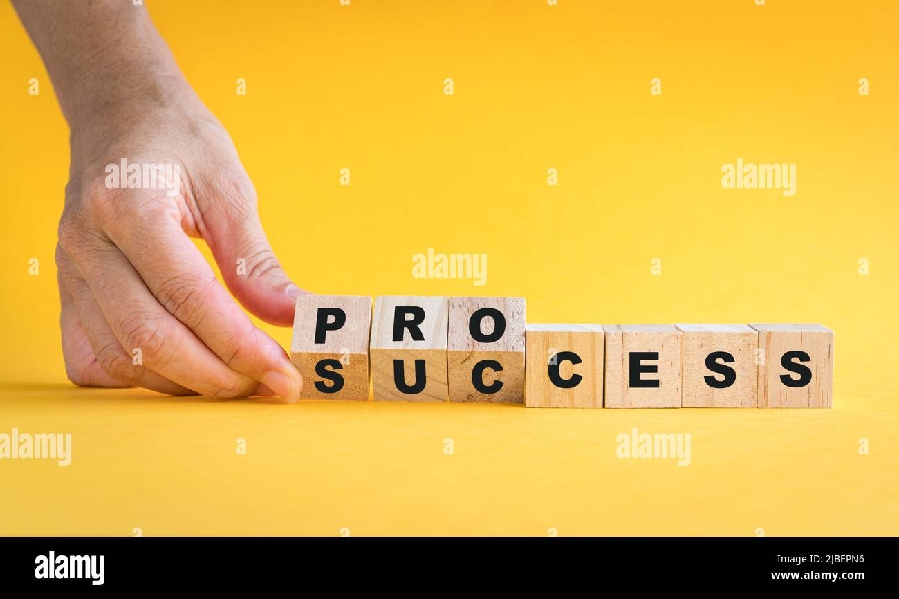 Success or process text. Wooden cube block flip over word process to ...