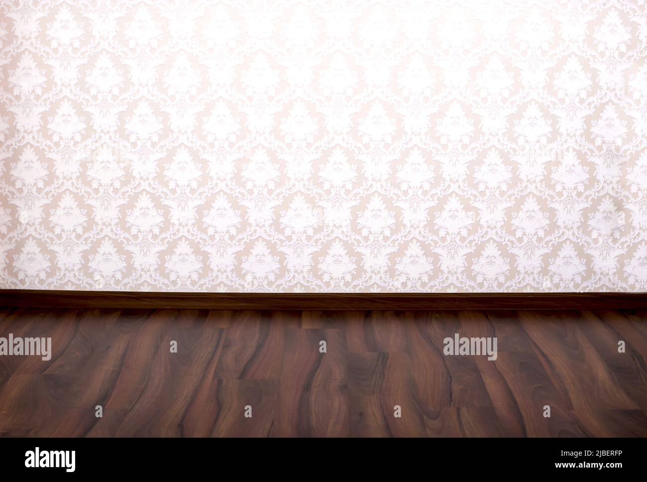 Wooden parquet floor and wallpaper on a wall close up Stock Photo - Alamy