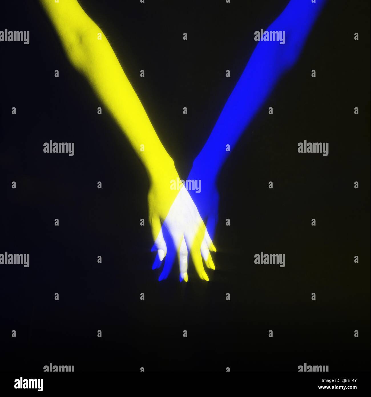 Abstract background concept. Two crossed arms in blue and yellow colors ...