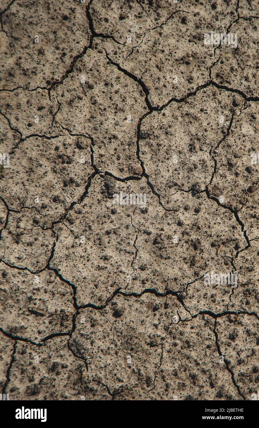 Dry cracked ground background texture Selective focus Stock Photo - Alamy
