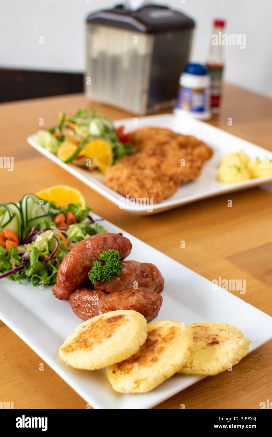 Colombia traditional dish of chorizo with tortillas and salad Stock ...
