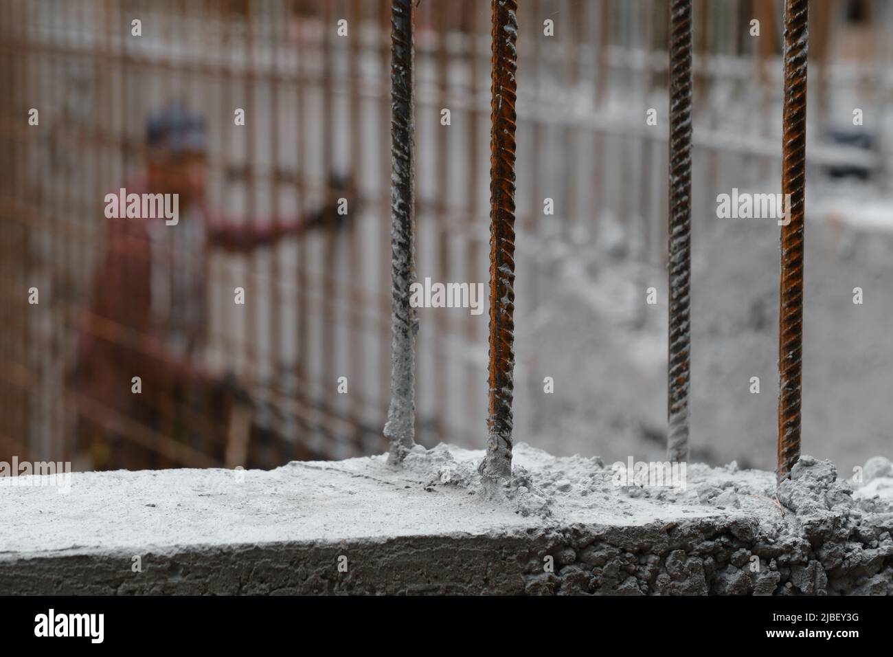 Construction of a concrete wall with reinforcement. Private house ...