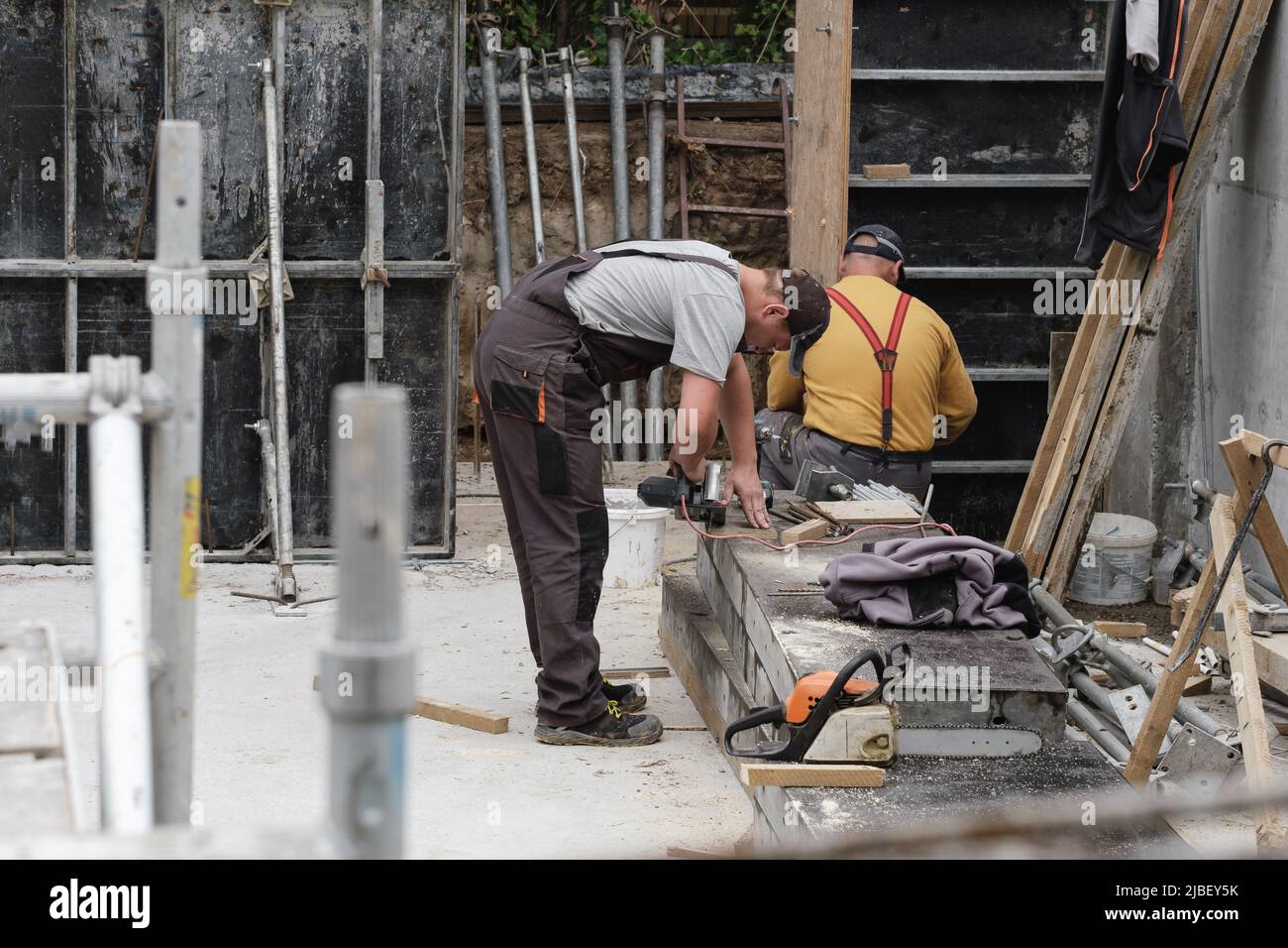 Construction of a concrete wall with reinforcement. Private house ...