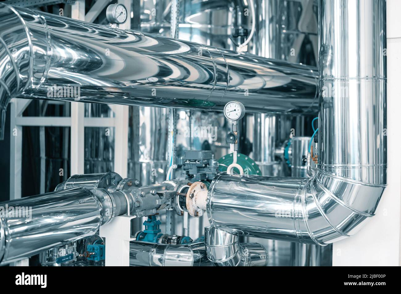 Complicated pipeline system in spacious workshop of plant Stock Photo ...