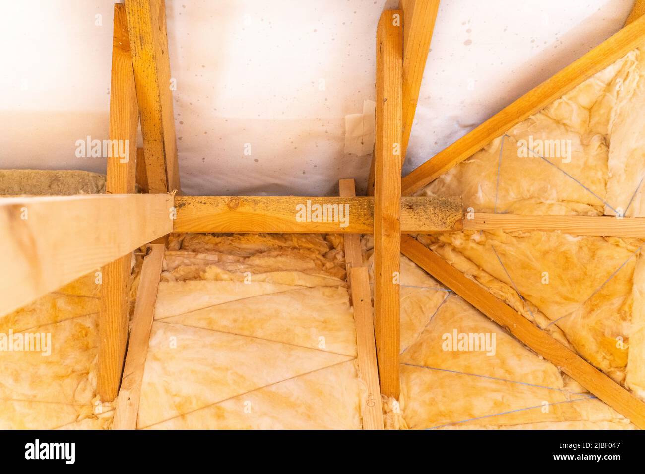 The roof is insulated with yellow glass wool. Proper roof insulation ... The roof is insulated with yellow glass wool. Proper roof insulation ...