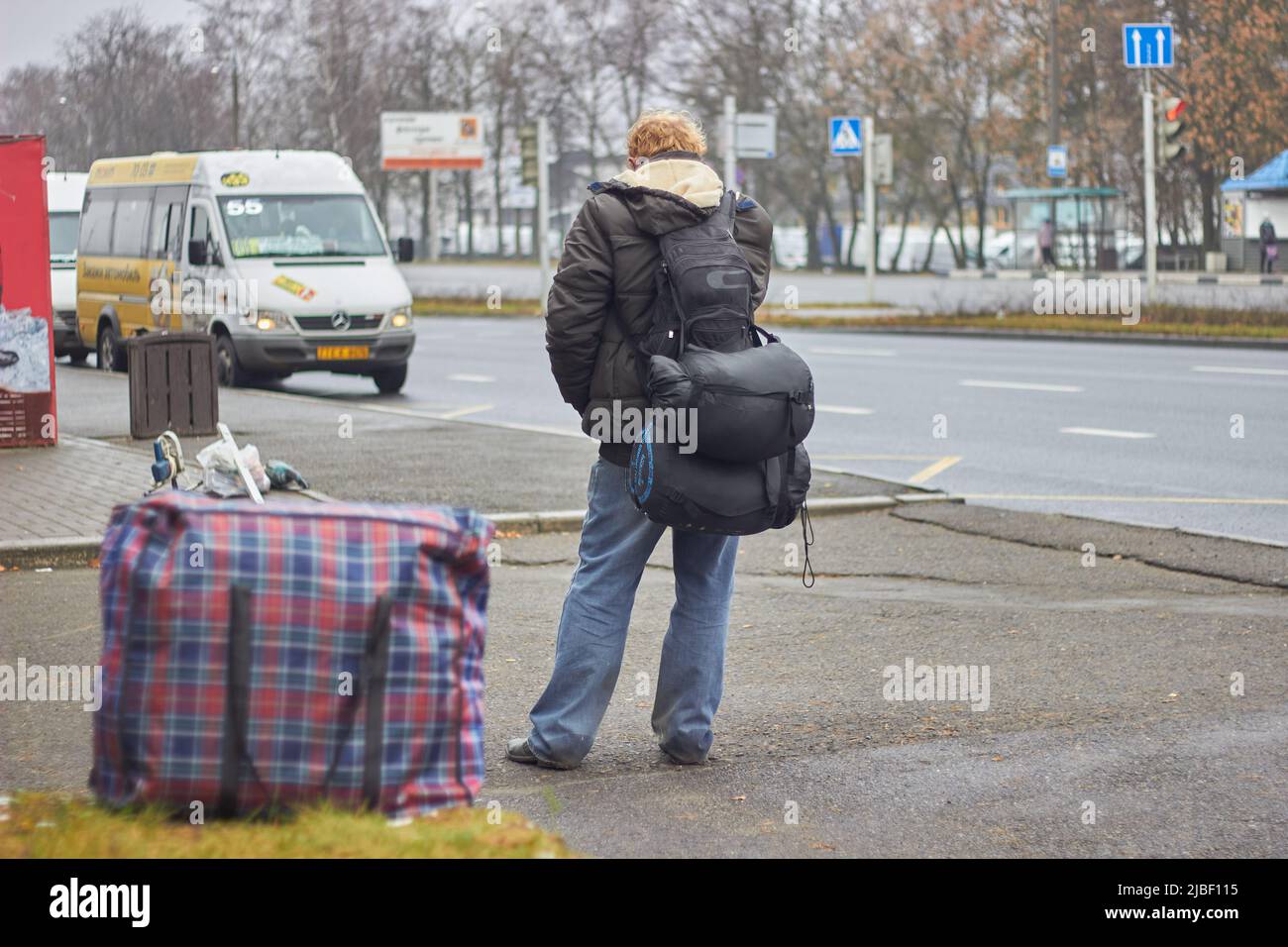 Public transportation people with backpack looking at arriving tram at ...