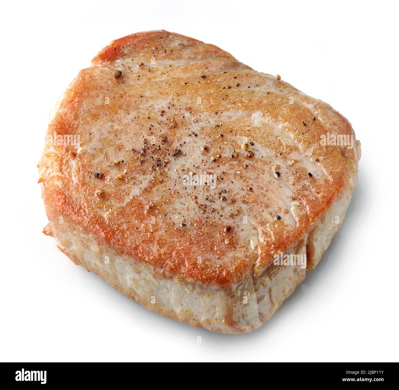 freshly fried tuna fish steak with pepper isolated on white background ...