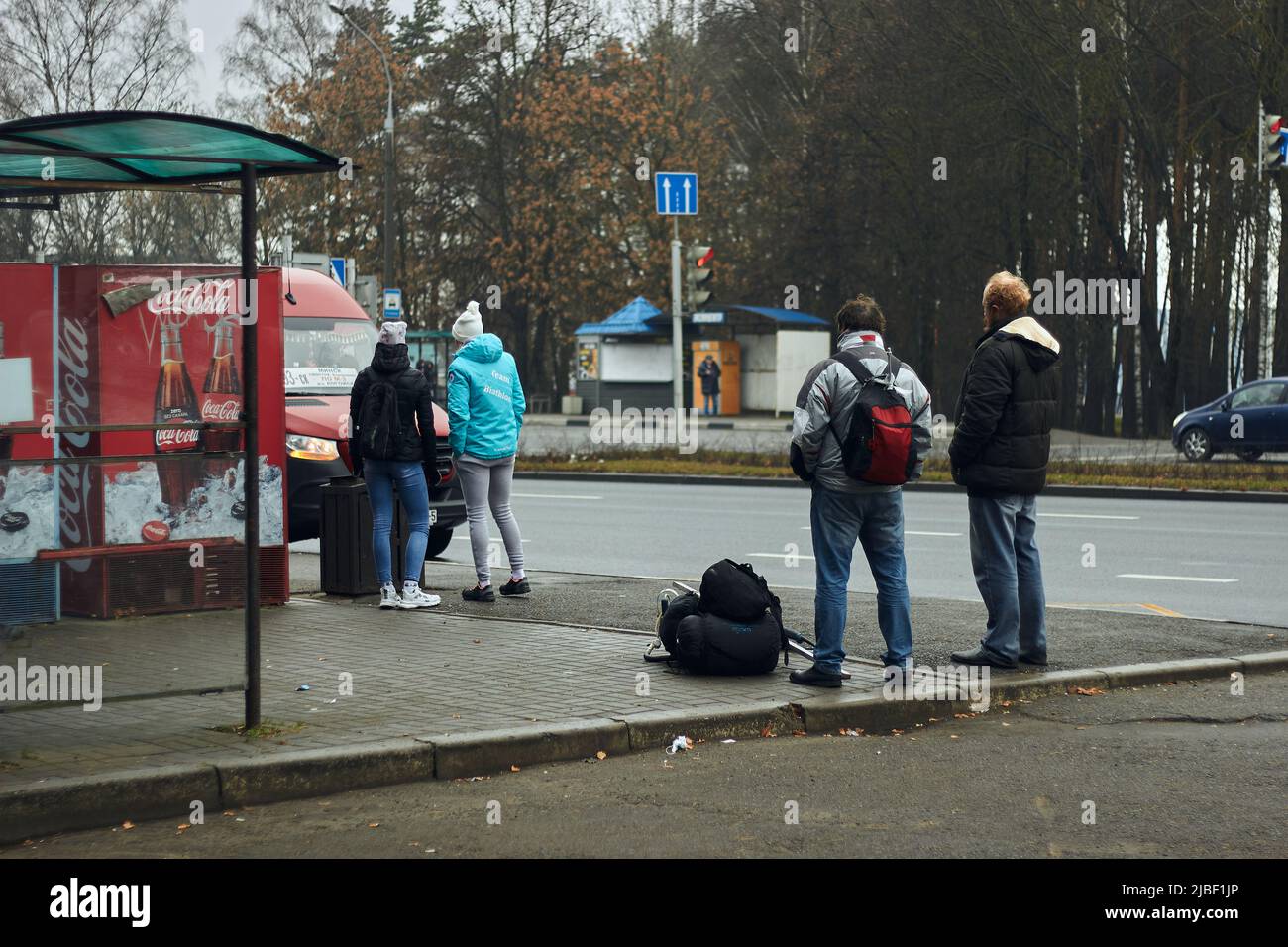 Public transportation people with backpack looking at arriving tram at ...