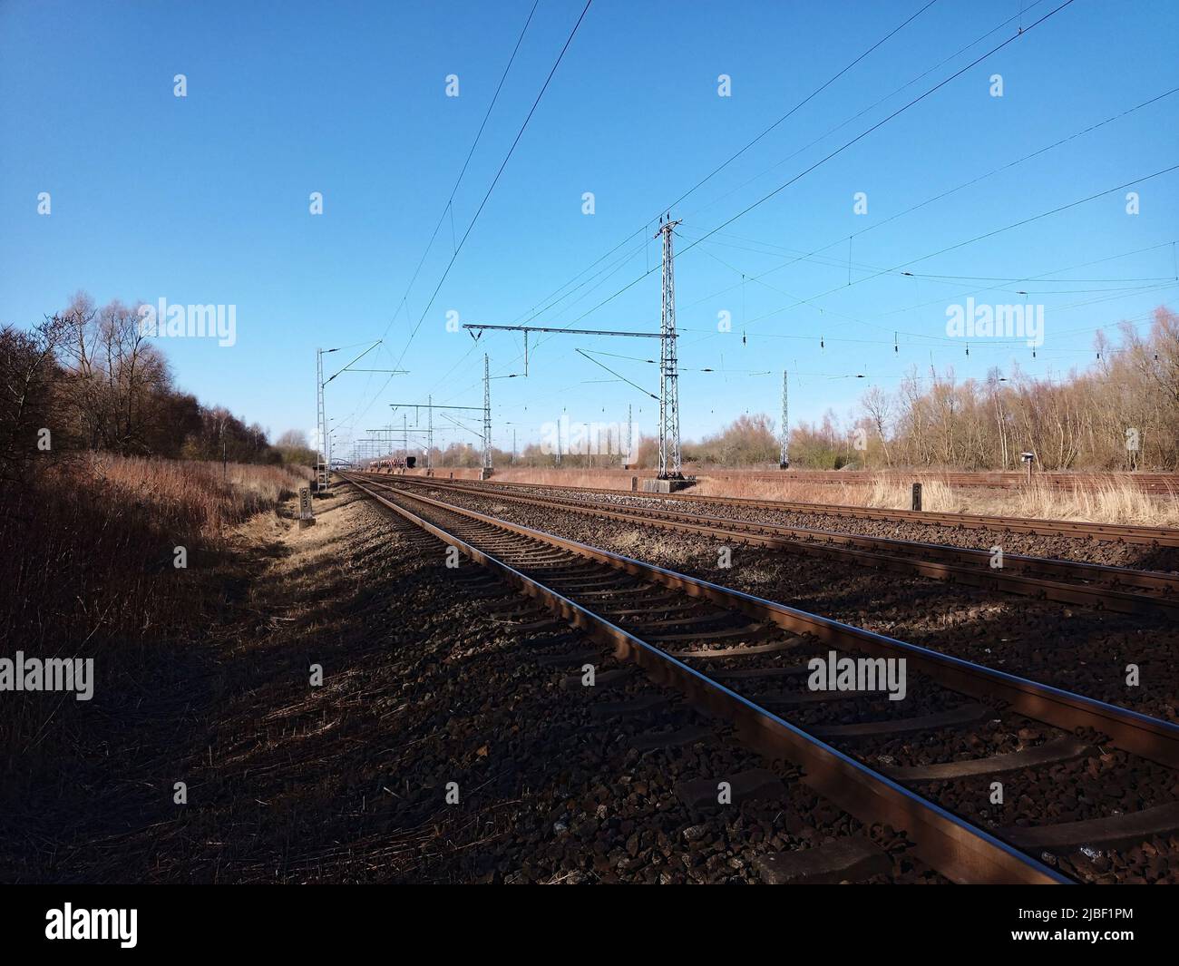 Railway tracks with shadows and sunlight in Germany Stock Photo - Alamy