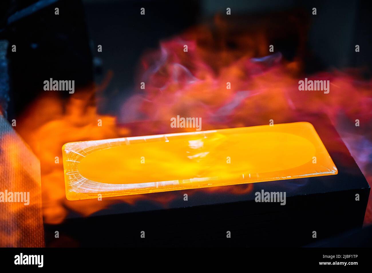 Hot gold ingot chills in casting form in shielding gases Stock Photo ...