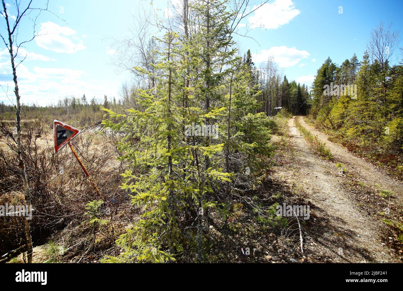 Small and desolate forest road in Sweden with a warning sign Stock ...