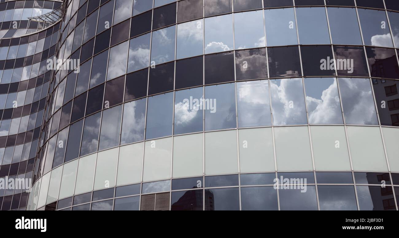 facade of a modern building covered in reflective plate glass ...