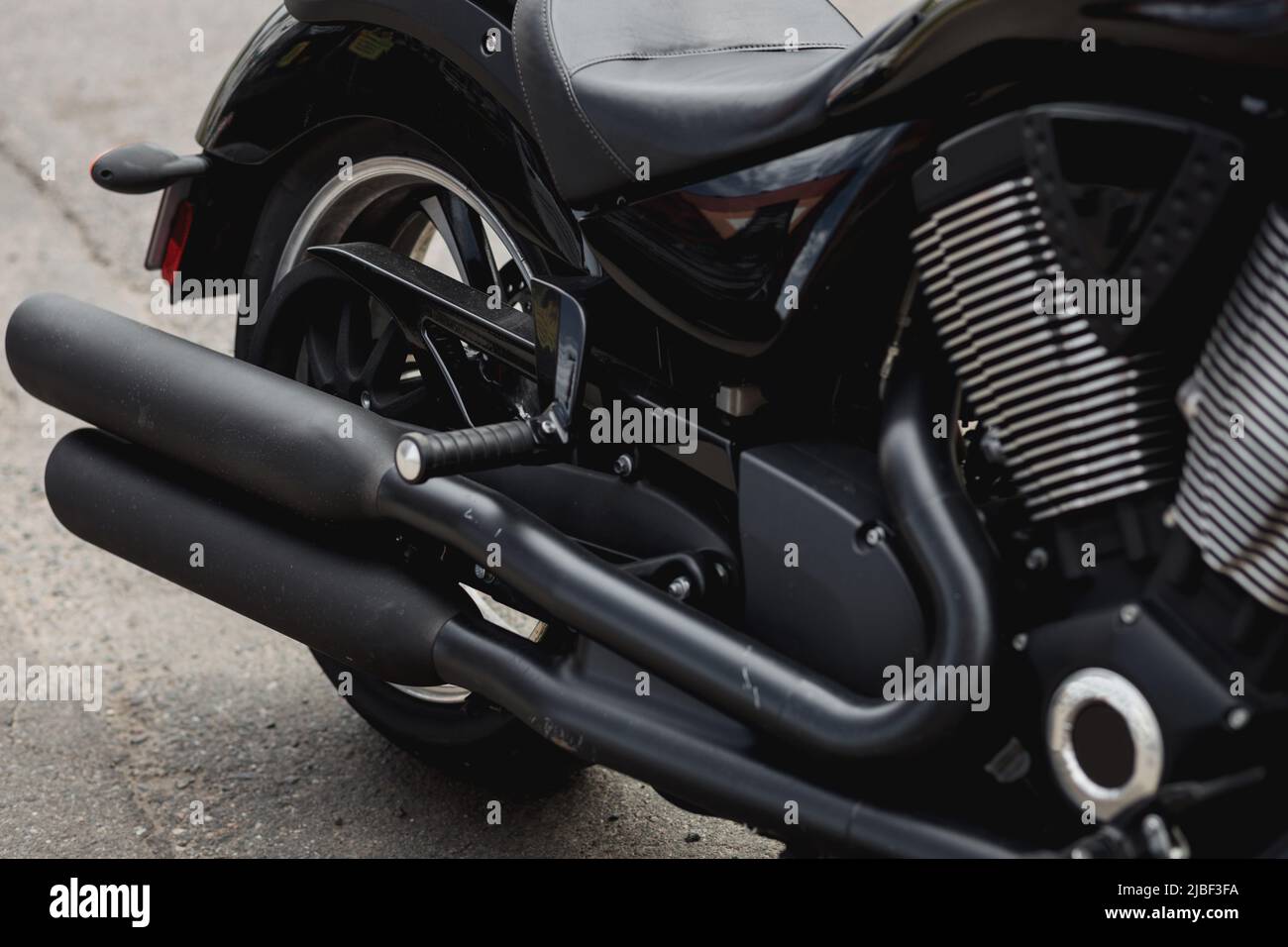 Black motorcycle exhaust pipe. part of the bike Stock Photo - Alamy