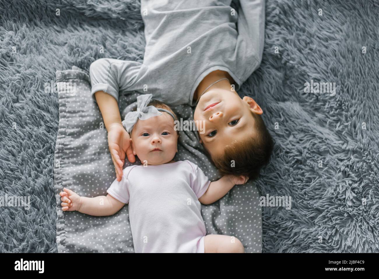 Mother and brother and sister inside hi-res stock photography and ...