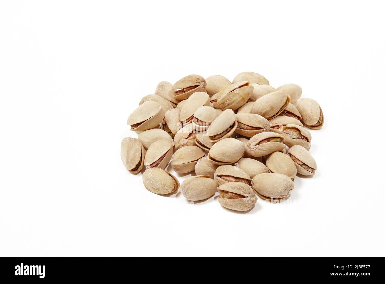 Pile of pistachios isolated on white background. Closeup of pistachios ...