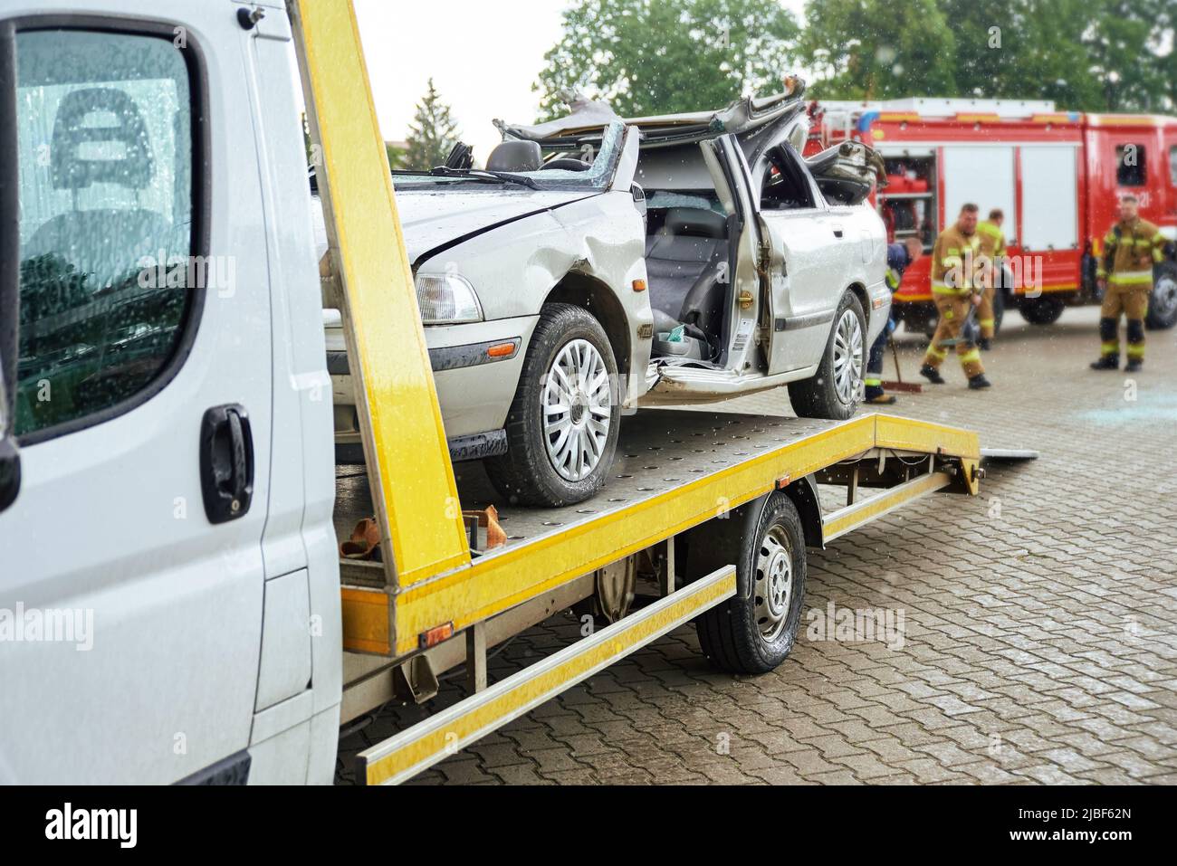 Wrecked car loading on tow truck after crash traffic accident, Concept ...