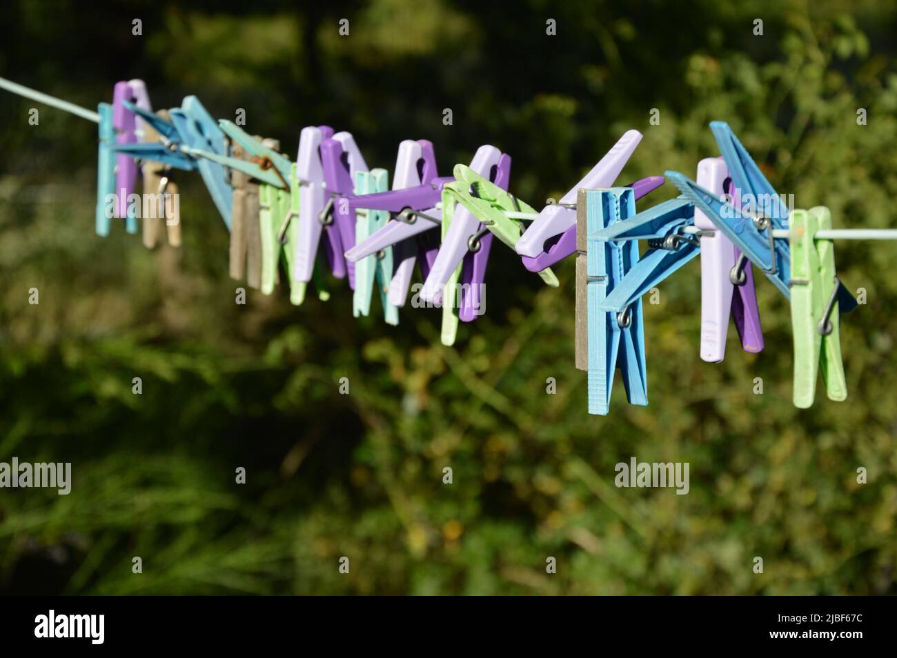 Clothespins on rope drying hi-res stock photography and images - Alamy