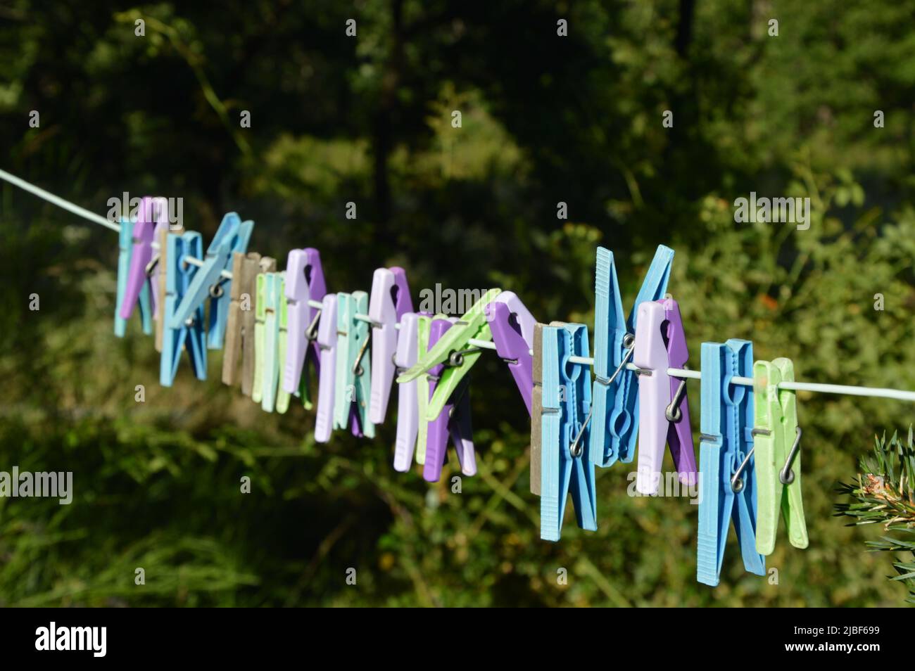 Clothespins on rope drying hi-res stock photography and images - Alamy
