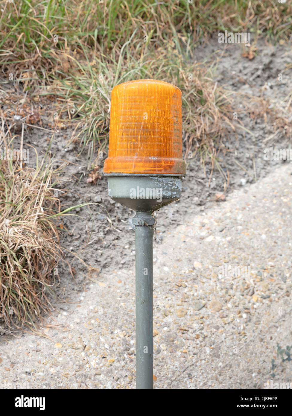 Orange warning light on a pole, selective focus Stock Photo - Alamy