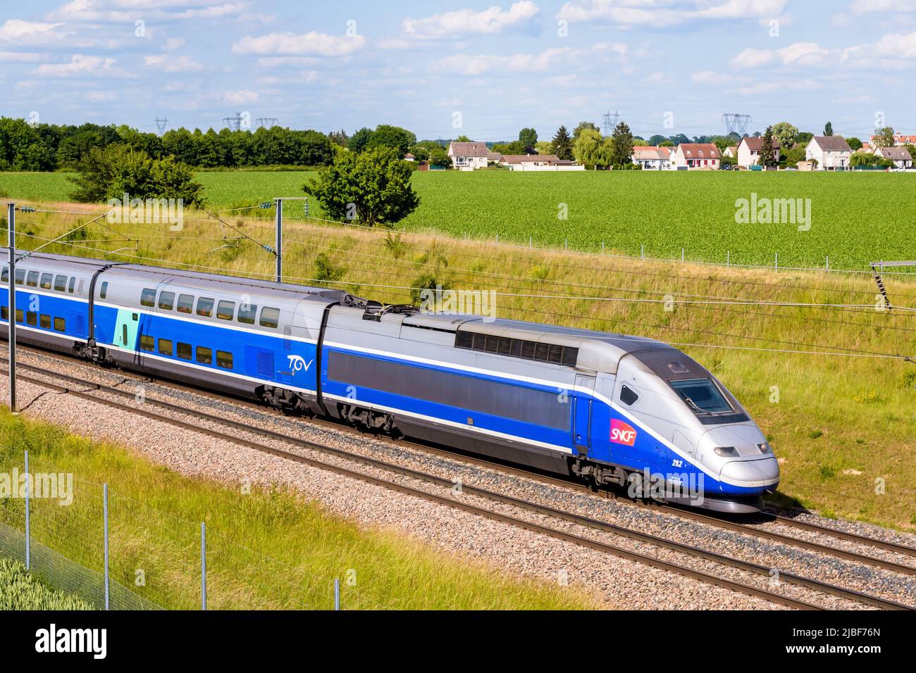 A TGV Duplex high speed train from french rail company SNCF is driving from Paris on the LGV Sud ...