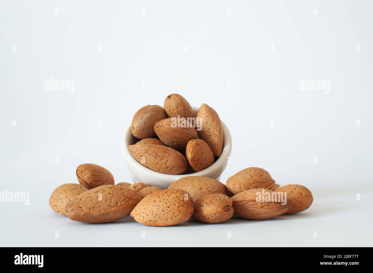 Close up profile view of natural organic Turkish almonds with hard ...