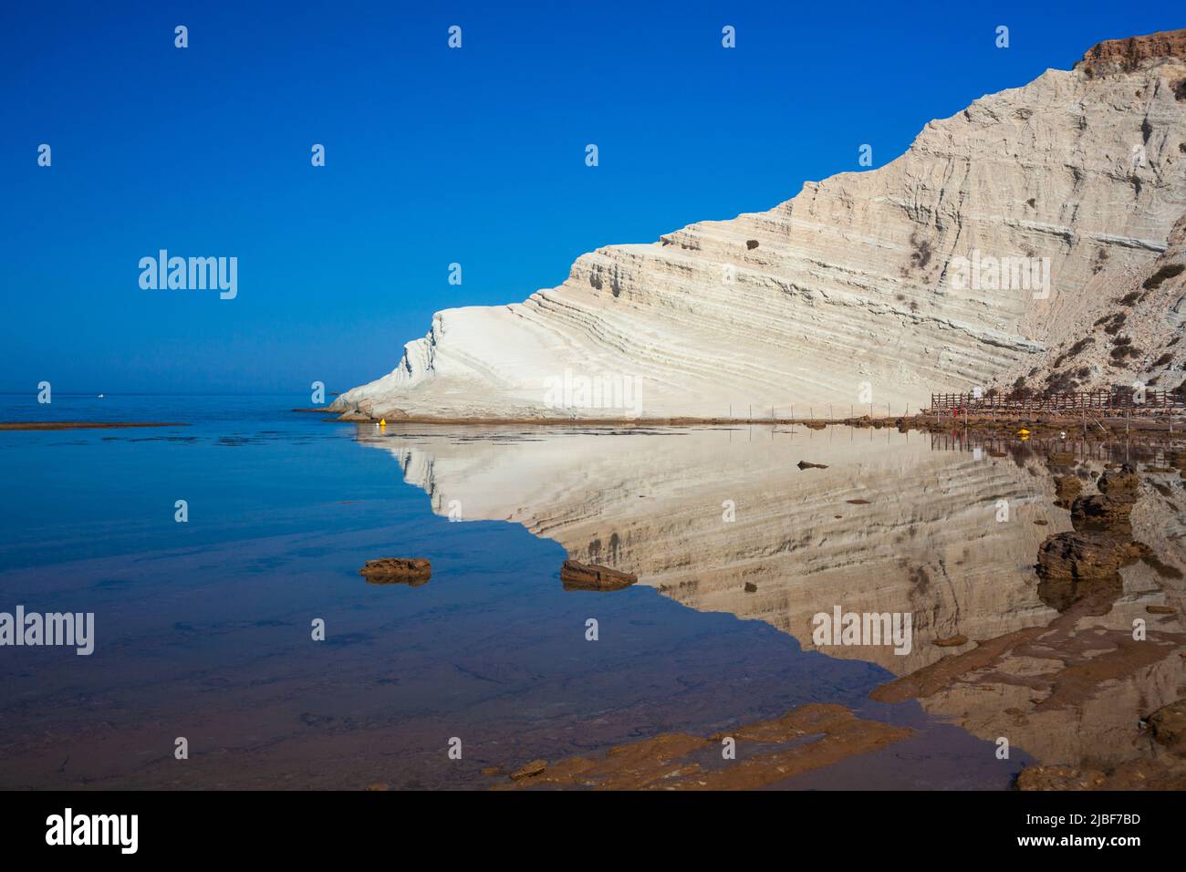 View of the limestone white cliffs with beach at the Scala dei Turchi ...