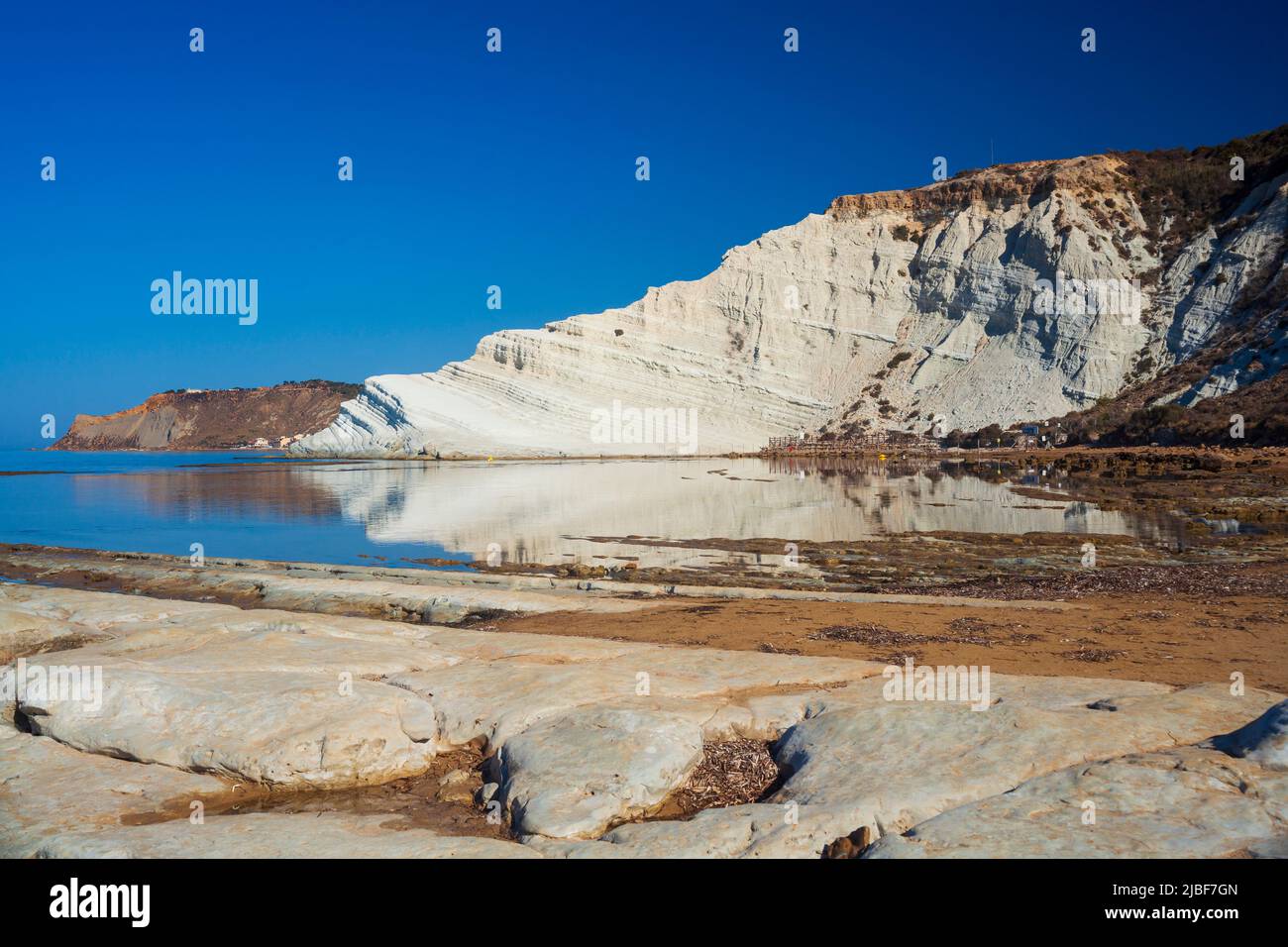 View of the limestone white cliffs with beach at the Scala dei Turchi ...