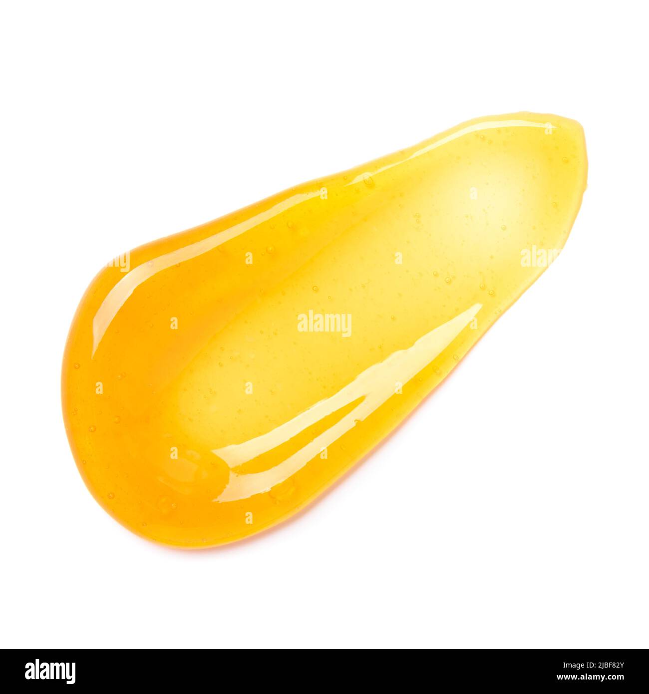 Clear transparent yellow face cream smear smudge, golden sugar honey ...