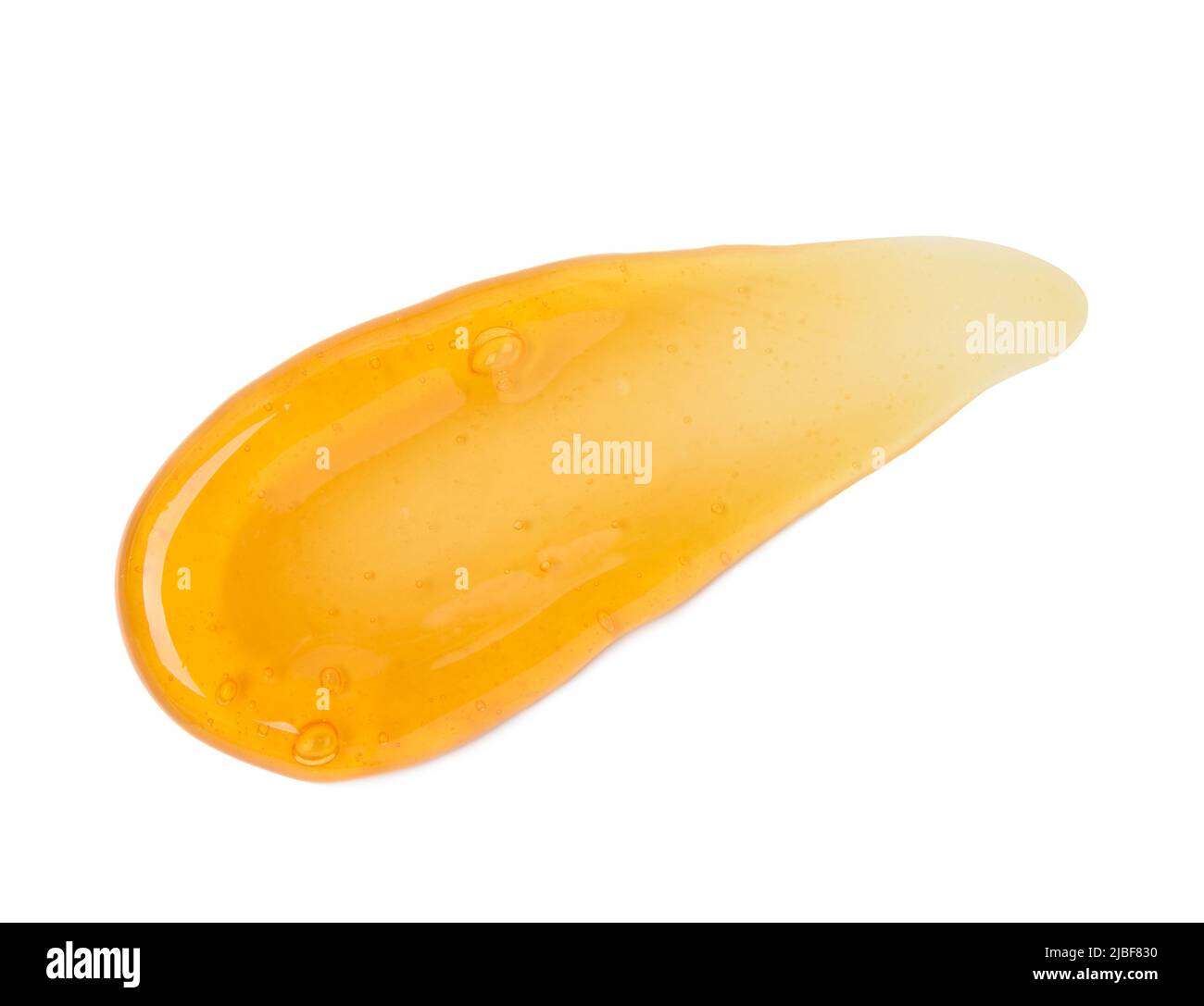 Clear orange gel smear smudge with bubbles macro isolated on white ...