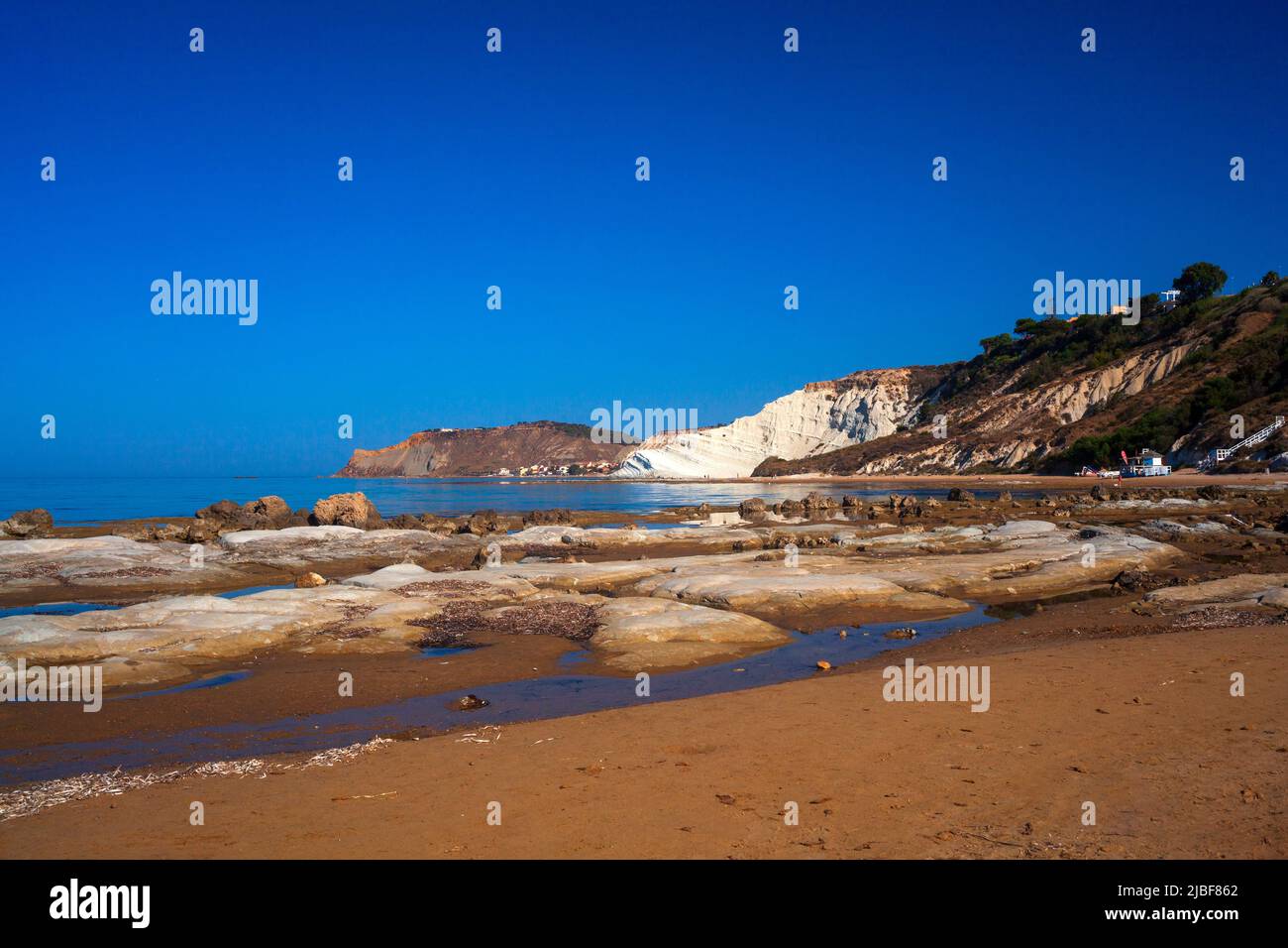 View of the limestone white cliffs with beach at the Scala dei Turchi ...