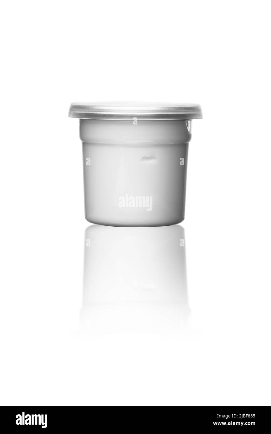 white cream or face mask in transparent package with metal tin lid ...