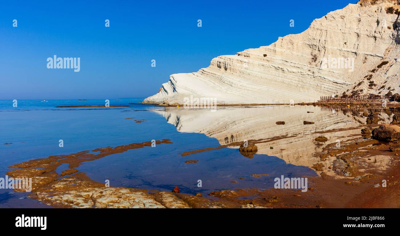 View of the limestone white cliffs with beach at the Scala dei Turchi ...
