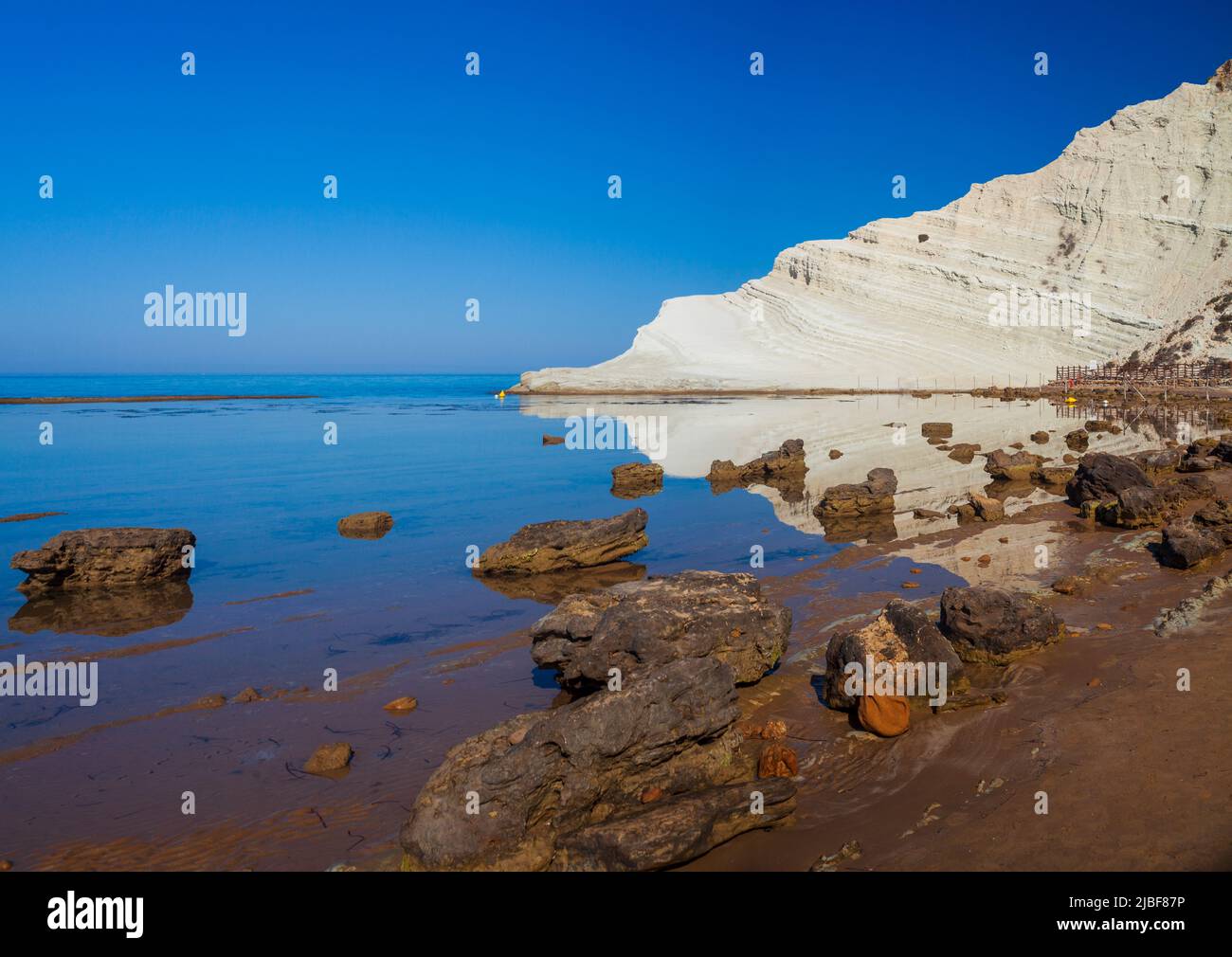 View of the limestone white cliffs with beach at the Scala dei Turchi ...