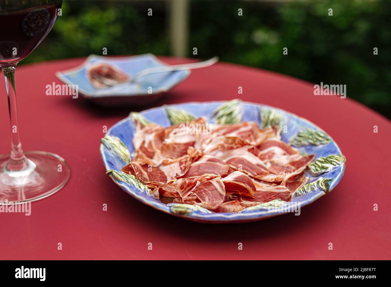 Side view on plate of spanish jamon appetizer Stock Photo - Alamy