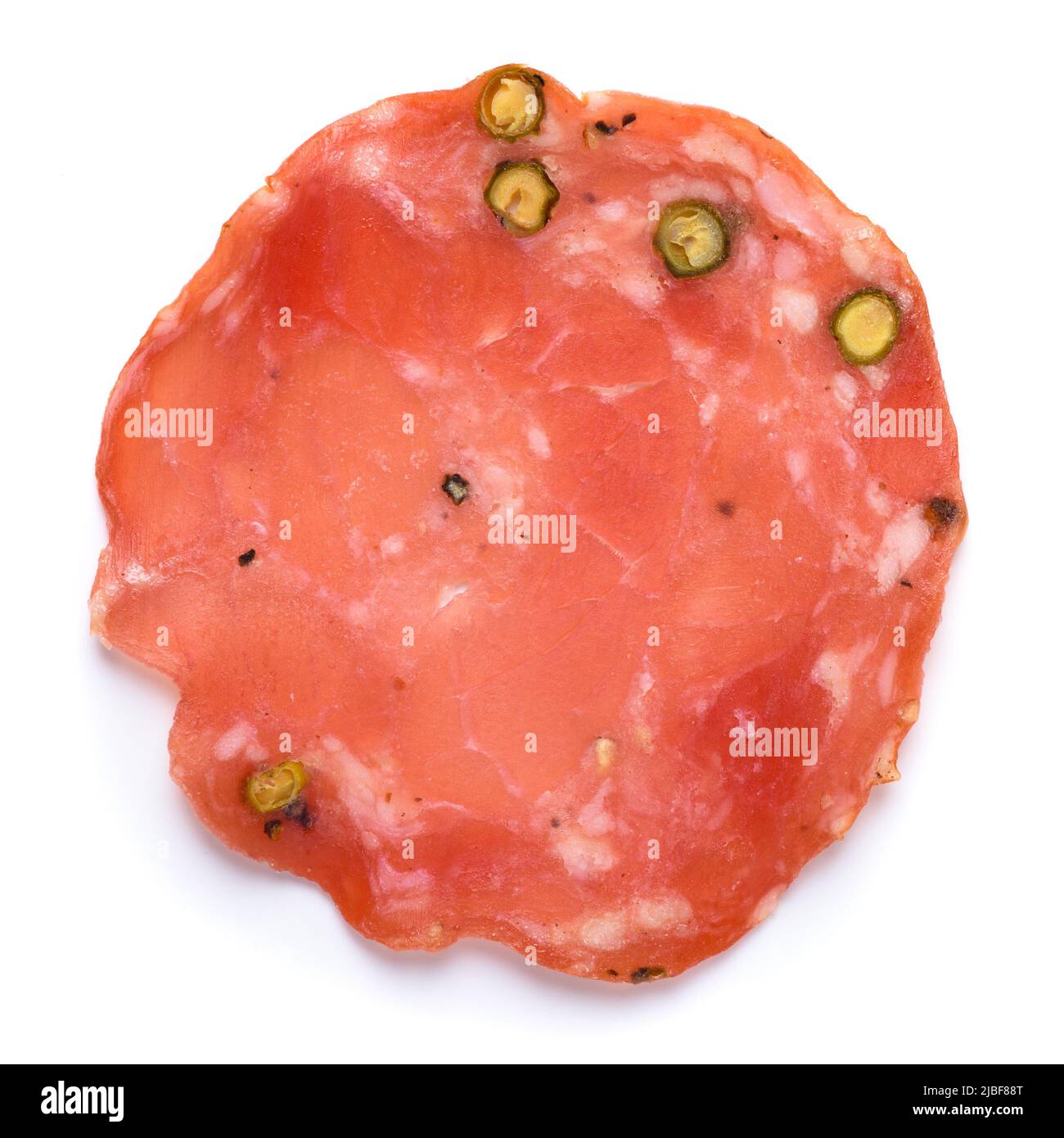 One dried smoked salami sausage slice with pepper isolated on white background top view Stock ...