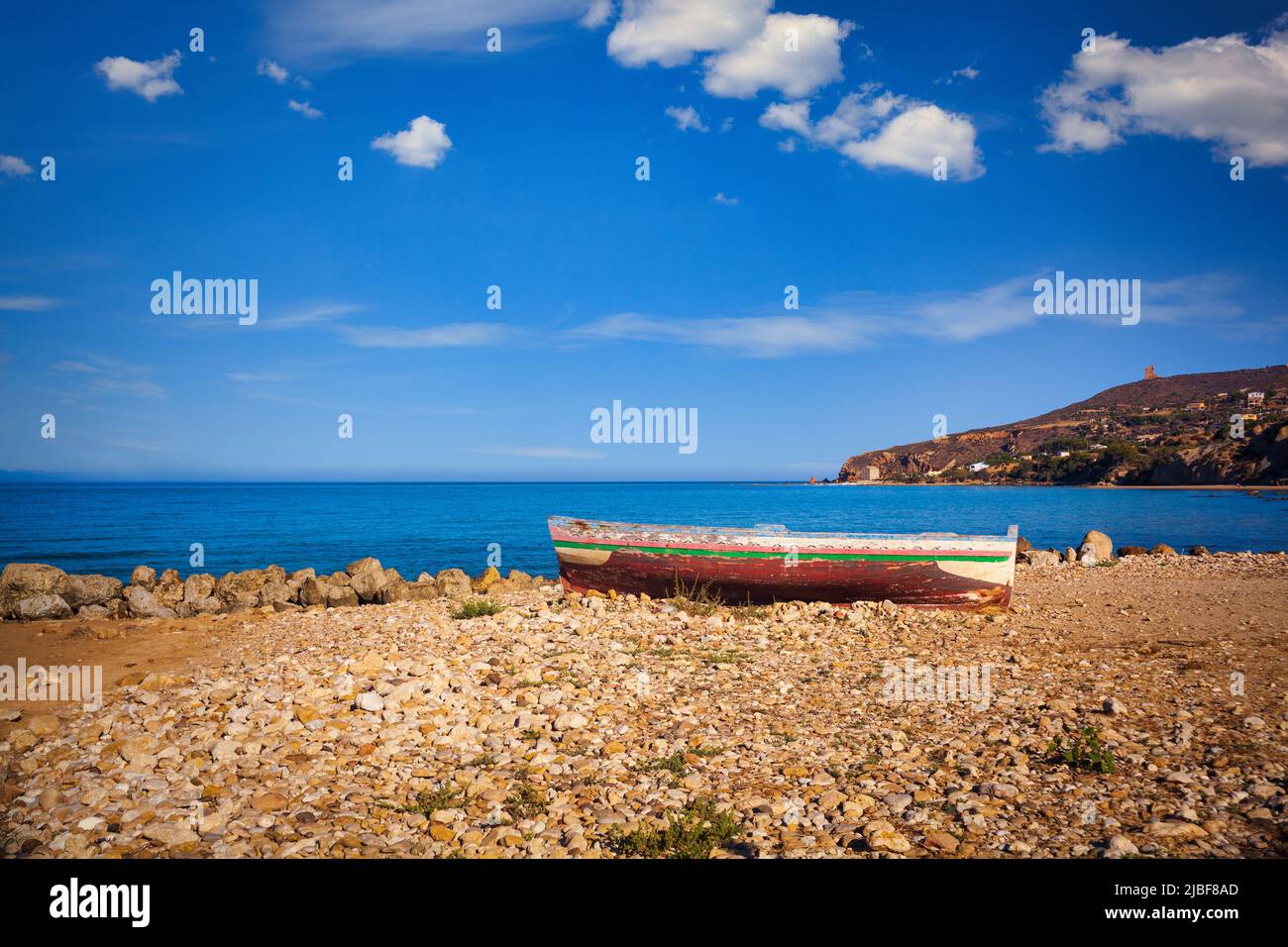 A Broken migrant boat stranded on the beach of the Agrigento coast ...