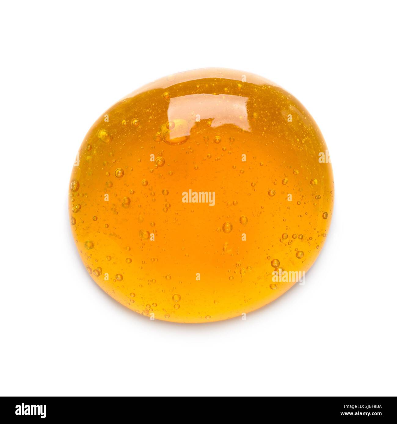 Drop of honey with bubbles isolated on white background top view Stock ...