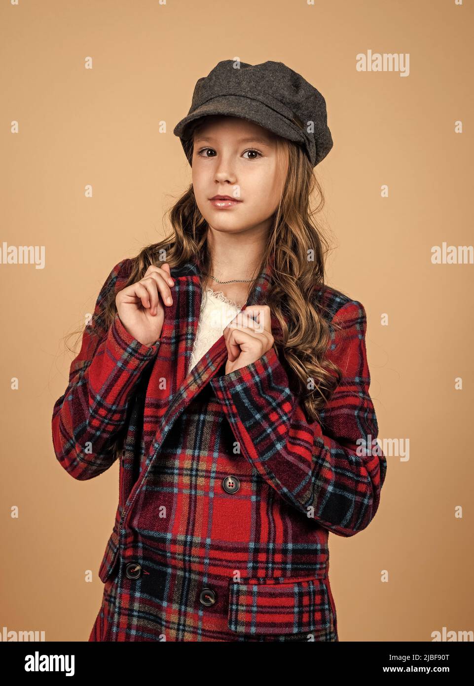 kid in cap with stylish hairstyle wear checkered jacket, childhood ...