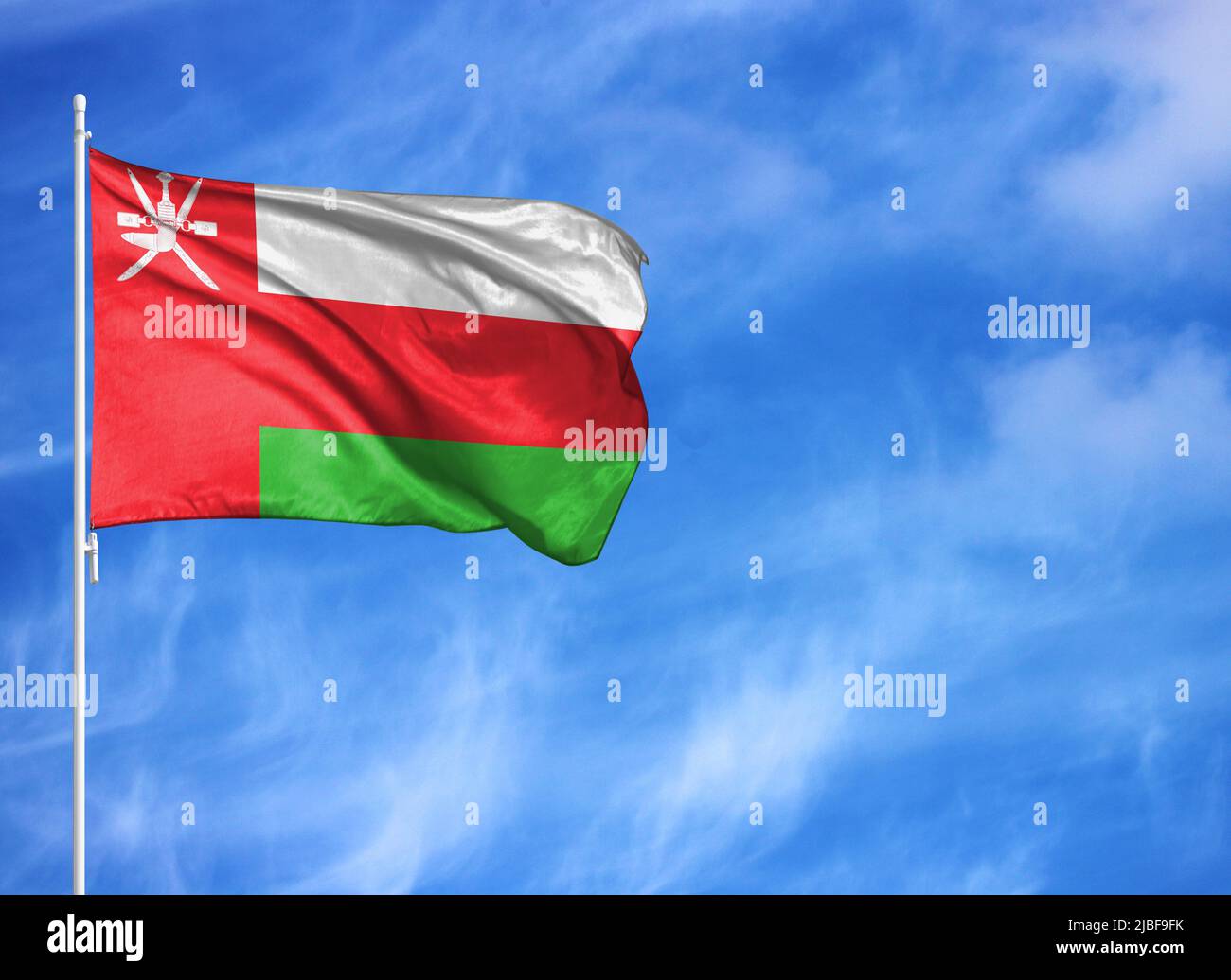 National flag of Oman on a flagpole Stock Photo - Alamy