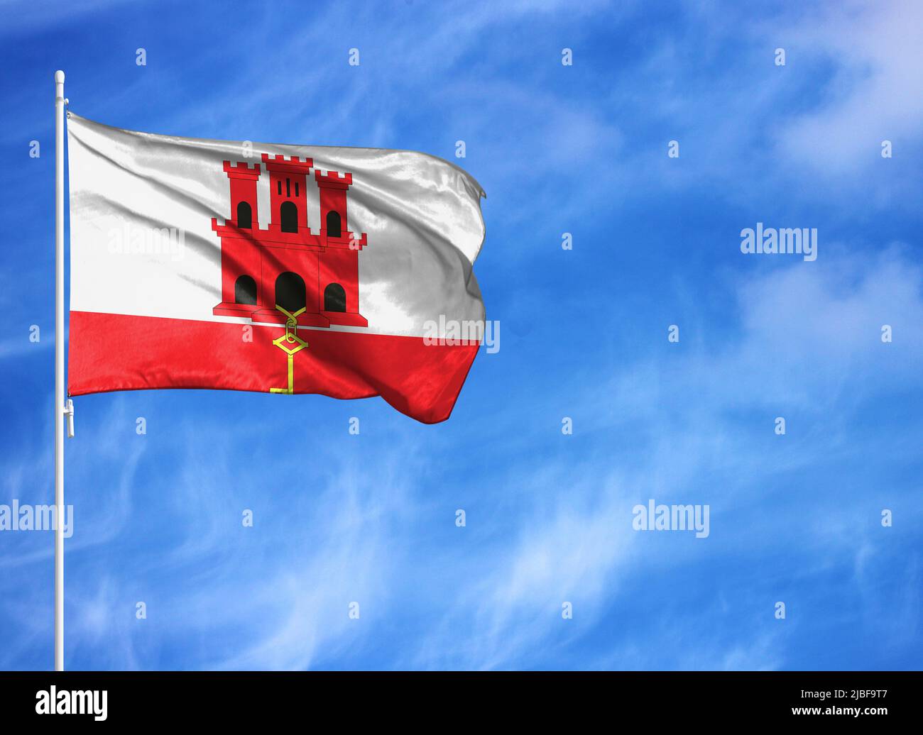 National flag of Gibraltar on a flagpole Stock Photo - Alamy