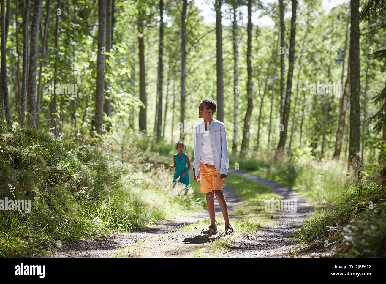 Two boys walking on trail hi-res stock photography and images - Alamy