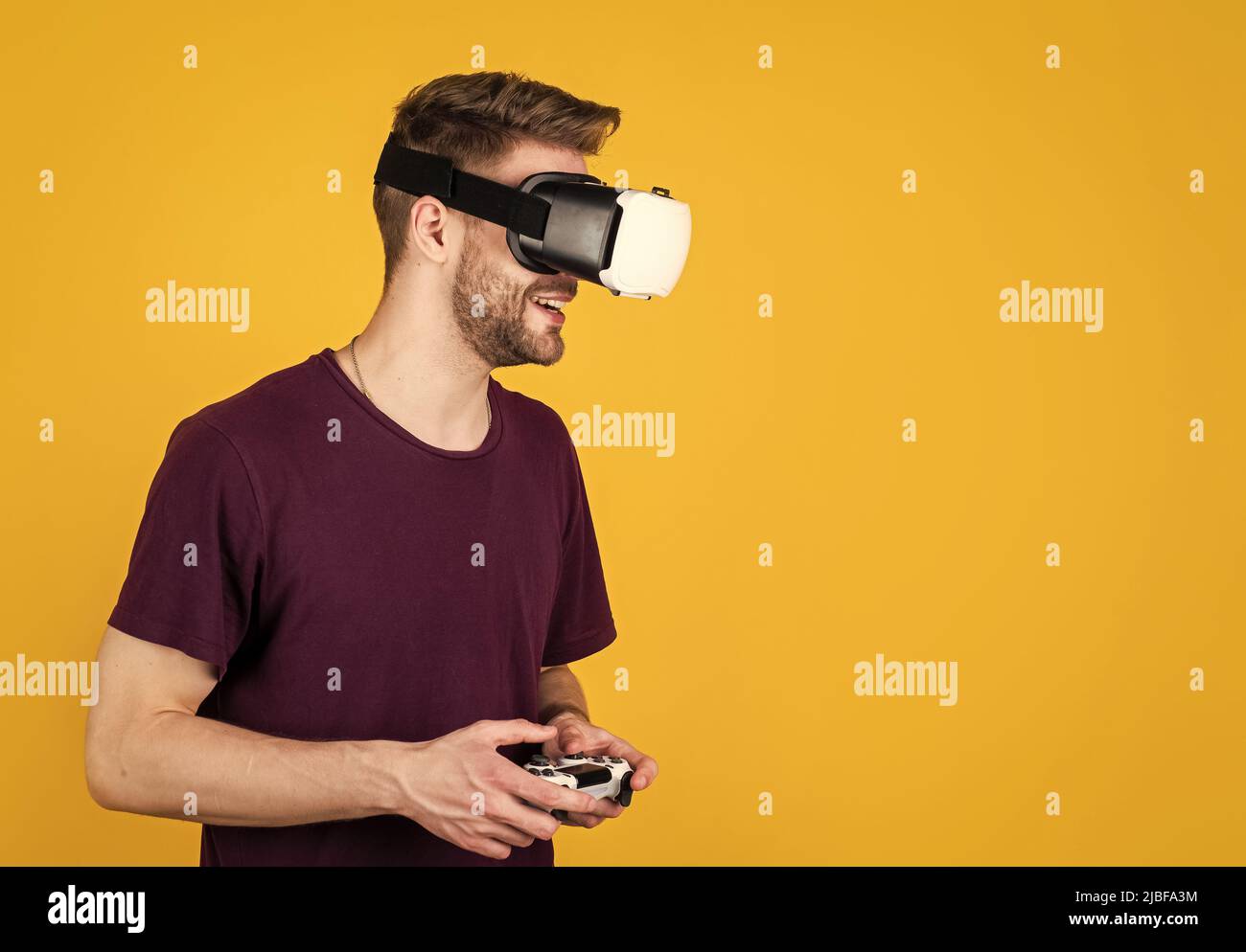 young guy with unshaven face and stylish hair wear wireless vr headset ...
