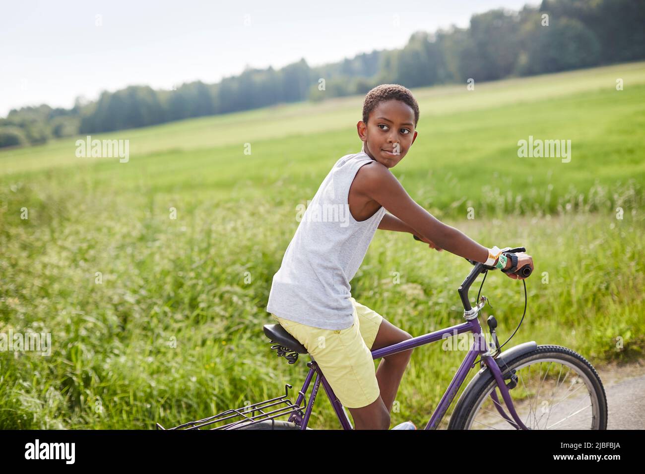 African boy on bicycle hi-res stock photography and images - Alamy