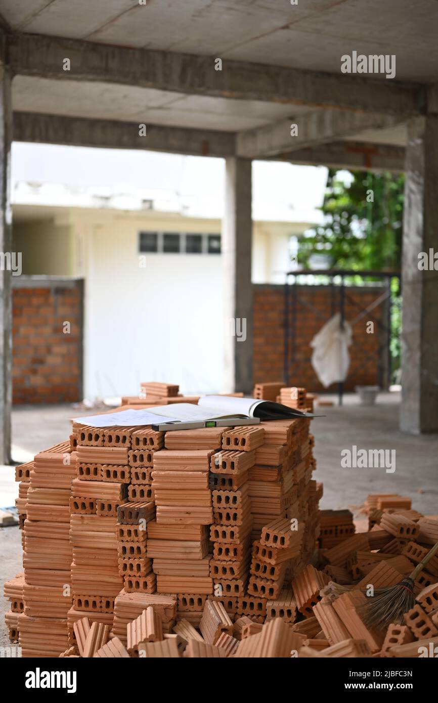 Pile of new bricks at the construction site. Concept of repair and ...