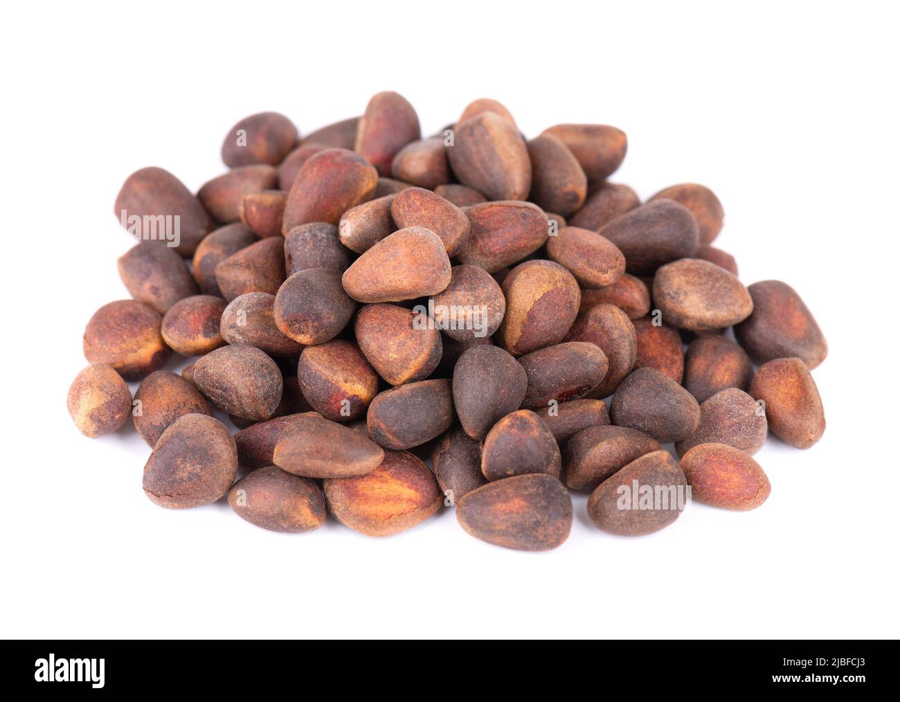 Pine nuts isolated on white background. Pine cones and heap of roasted ...
