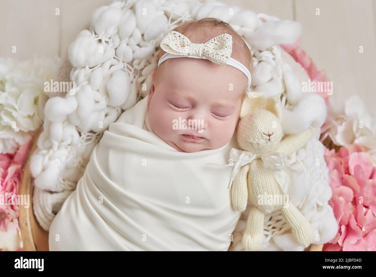 Newborn baby girl with toy bear. Healthy child. Happy motherhood and ...