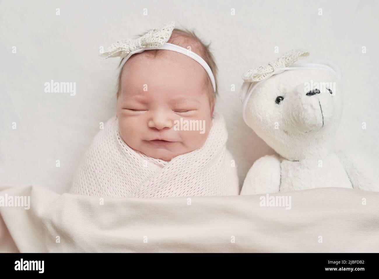 Newborn baby girl with toy bear. Healthy child. Happy motherhood and ...